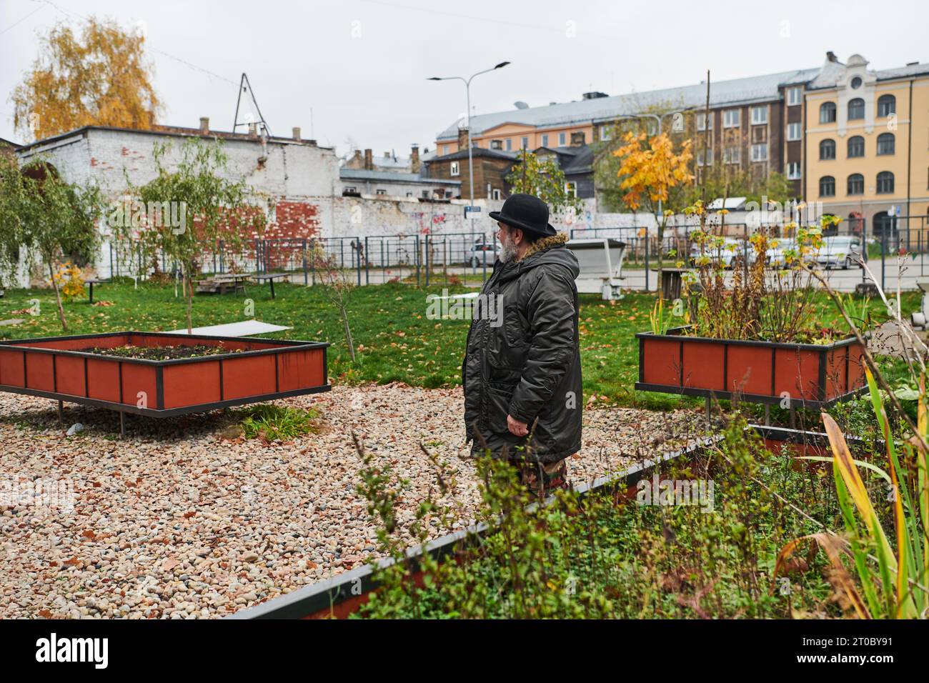 In the historic city of Riga, a bearded elderly man passionately ...