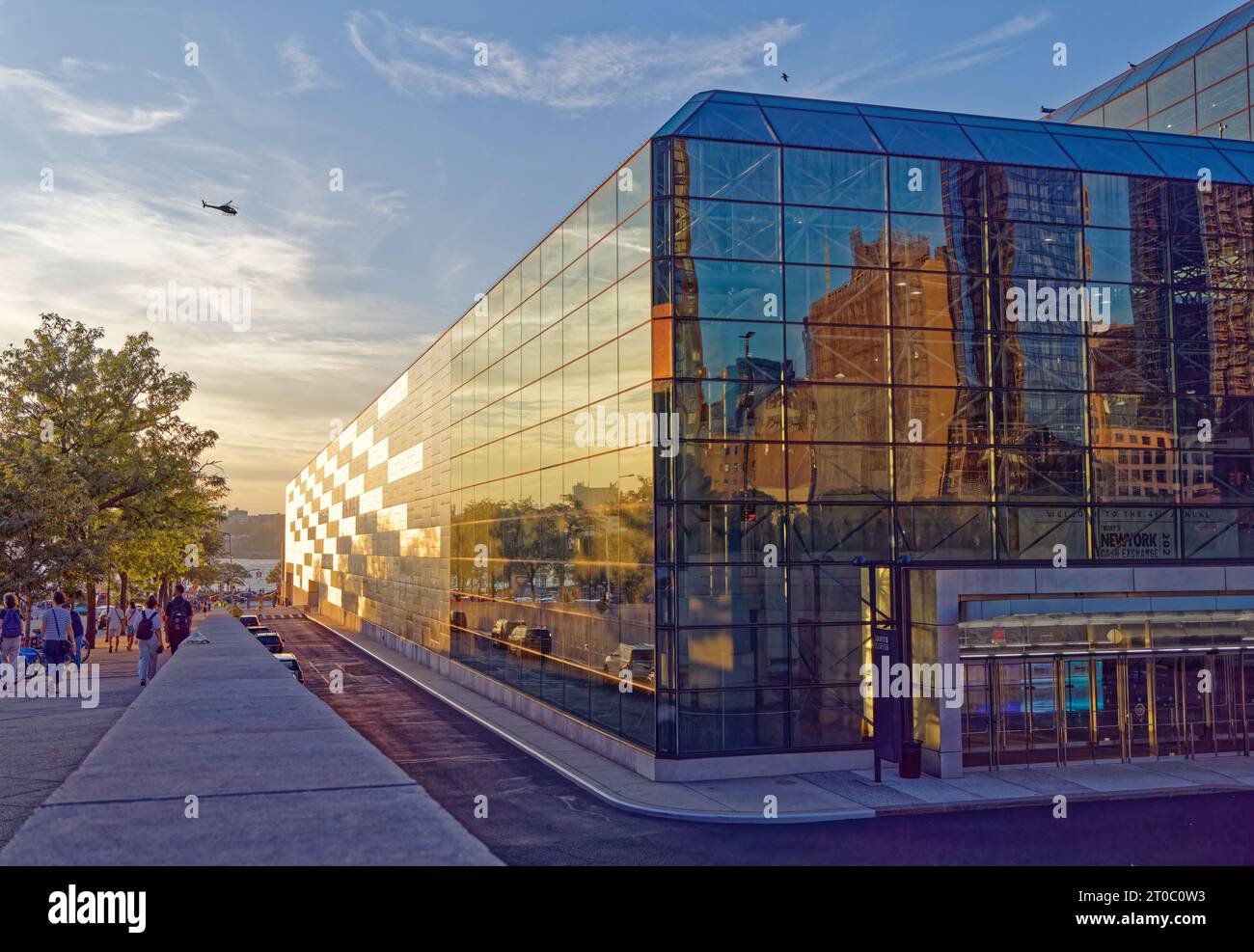 Jacob K. Javits Convention Center glows in the sunset, adjacent to ...