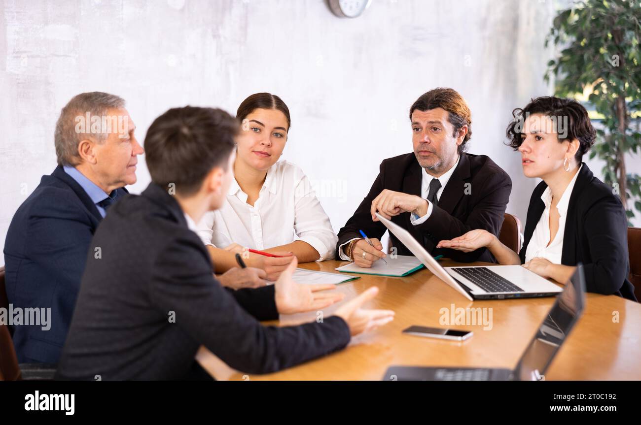 Top managers discussing in meeting room in modern office Stock Photo ...