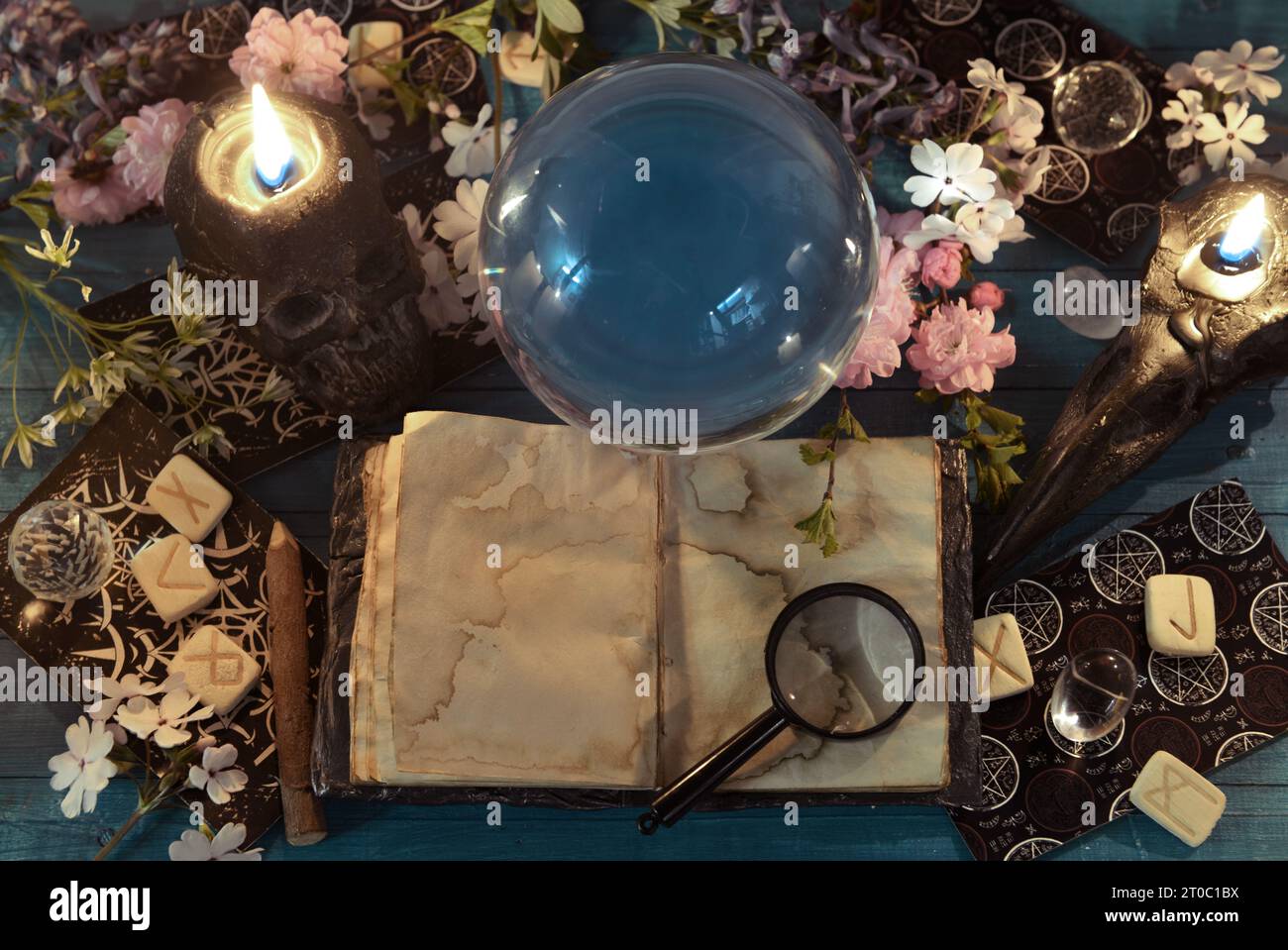 Magic crystal ball, tarot cards and book for spells on witch ritual ...