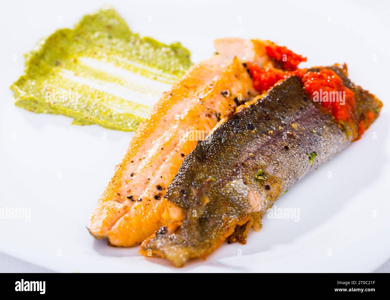 Roasted trout fillet with sauces Stock Photo - Alamy