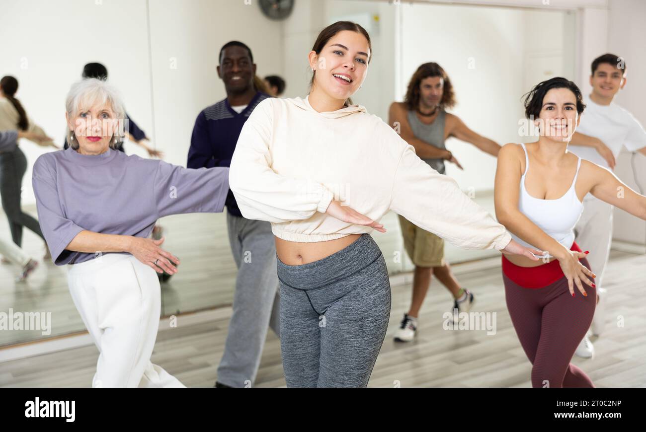 Group of dancing people practicing energetic swing Stock Photo - Alamy