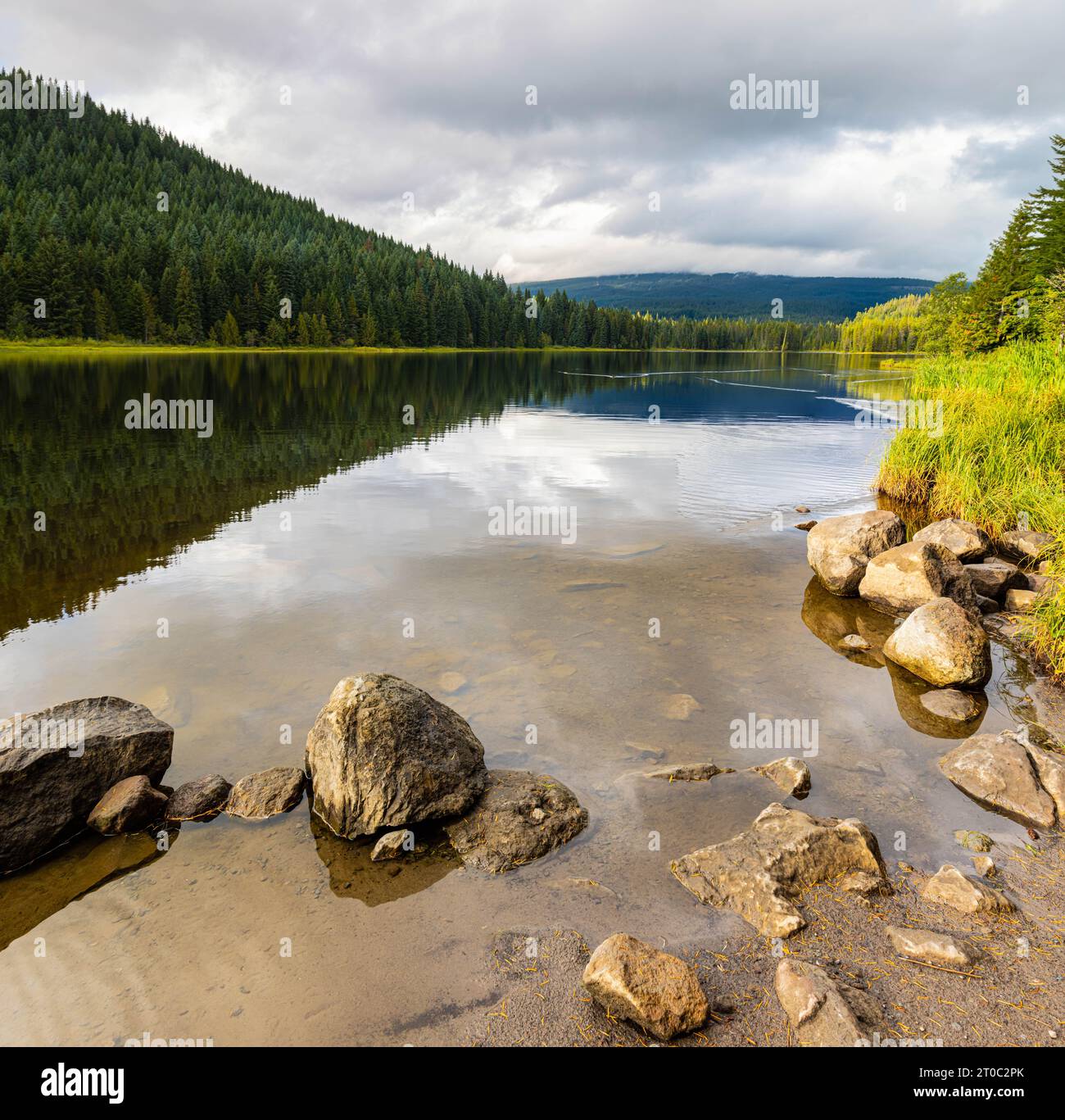 Low Clouds and Forested Shoreline Reflection on The Still Waters of ...