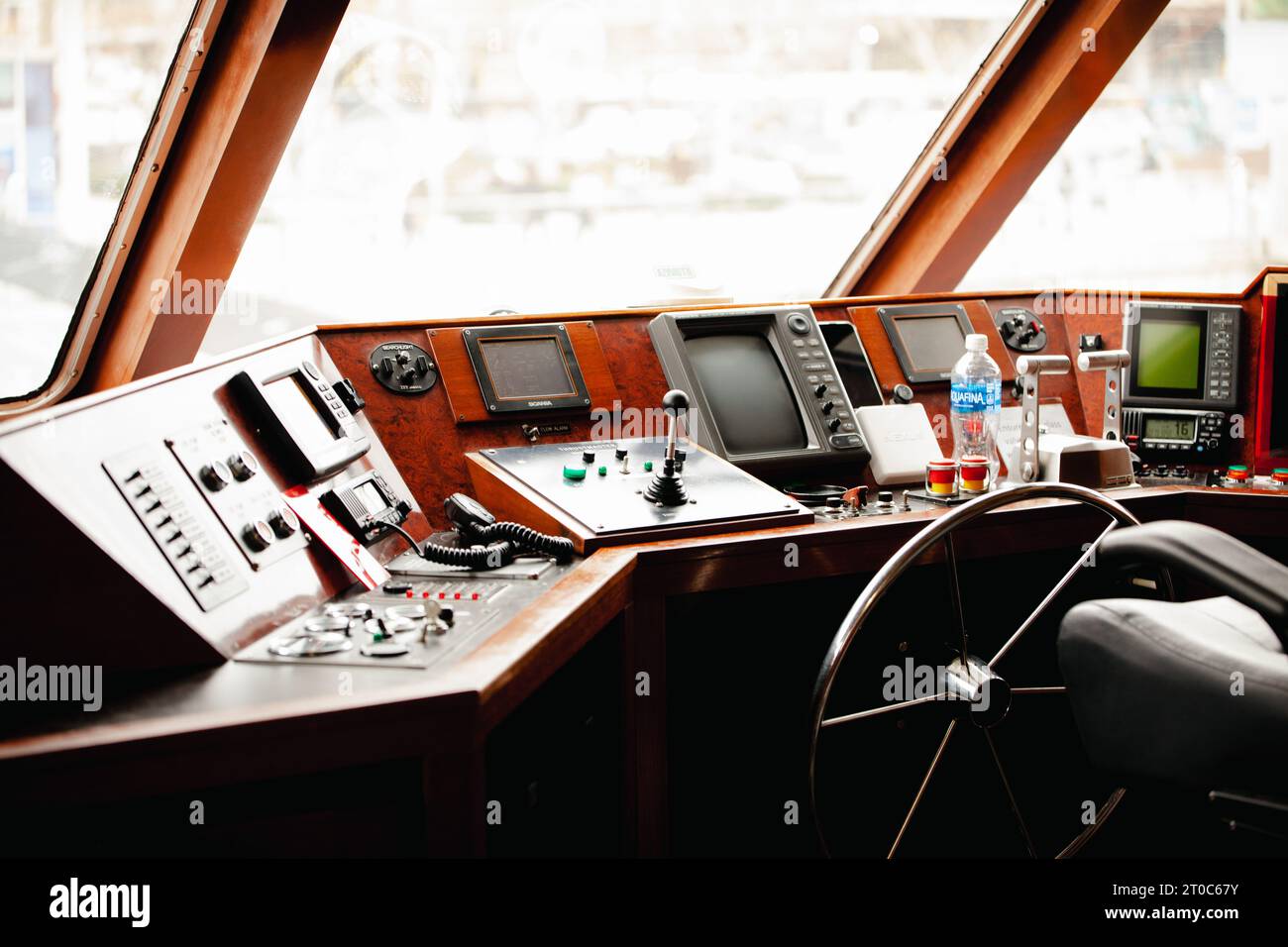 Inside of wheelhouse of the ship - captains control panel on the bridge ...