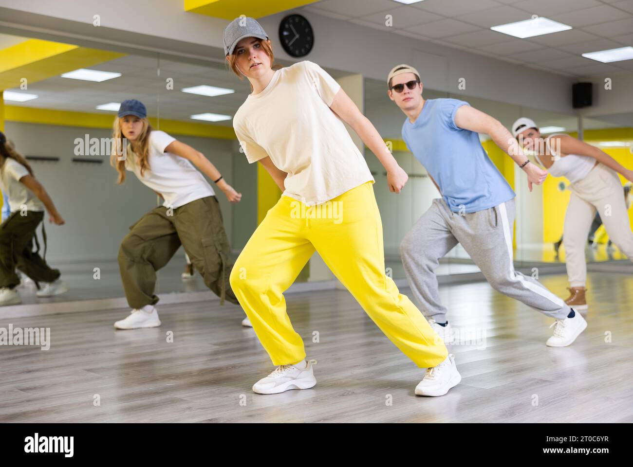 Teen girl in cap dances hip hop dances Stock Photo - Alamy