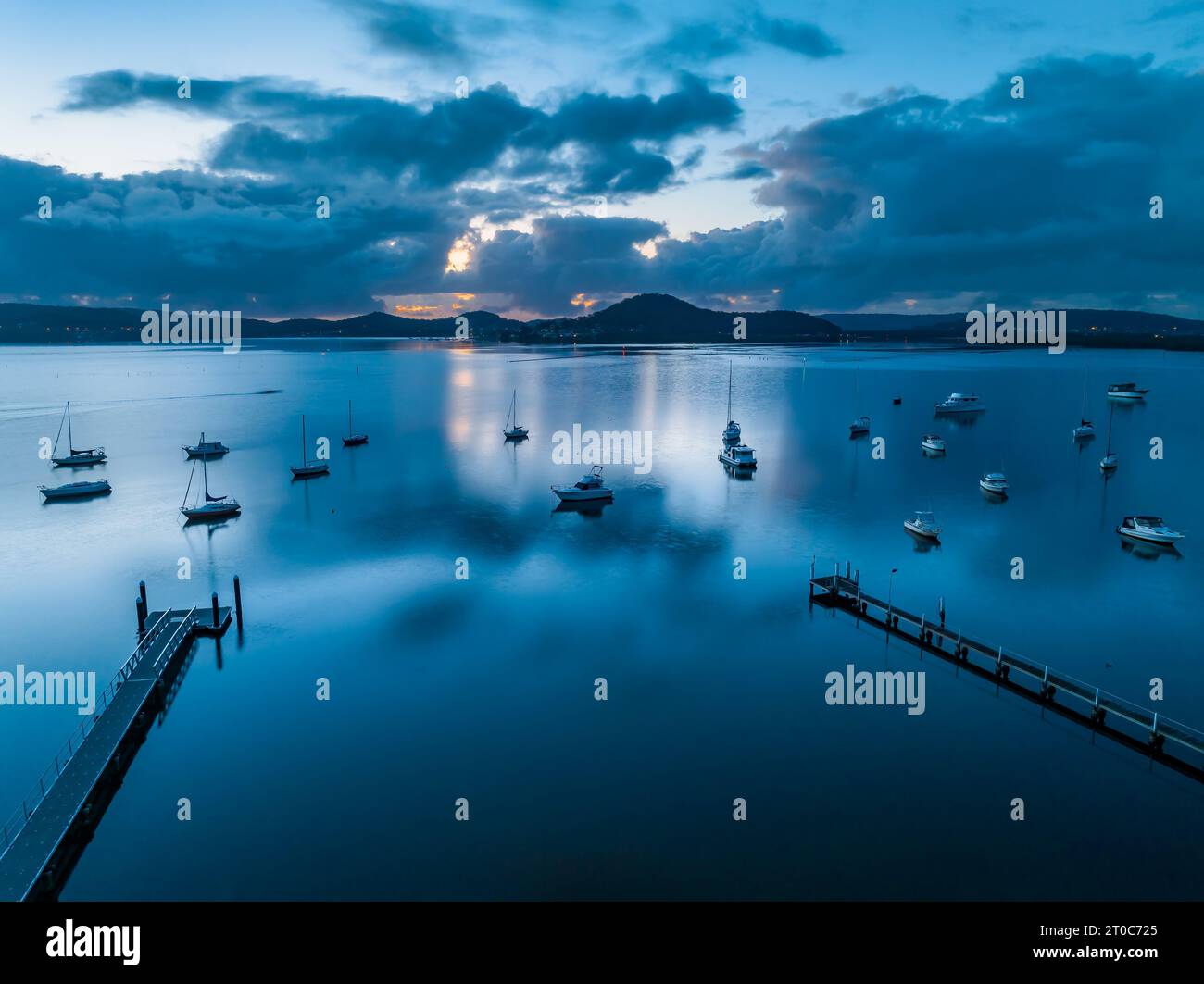 Sunrise, clouds, boats and reflections over Brisbane Water at Koolewong ...