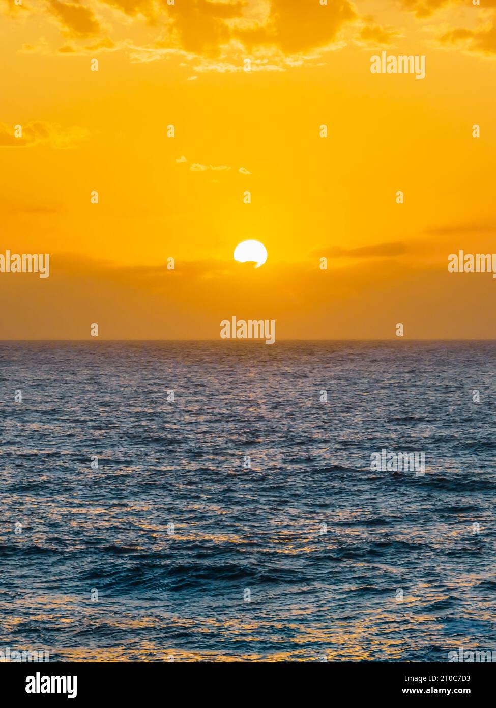 Sunrise seascape with clouds and sun at Avoca Beach on the Central ...
