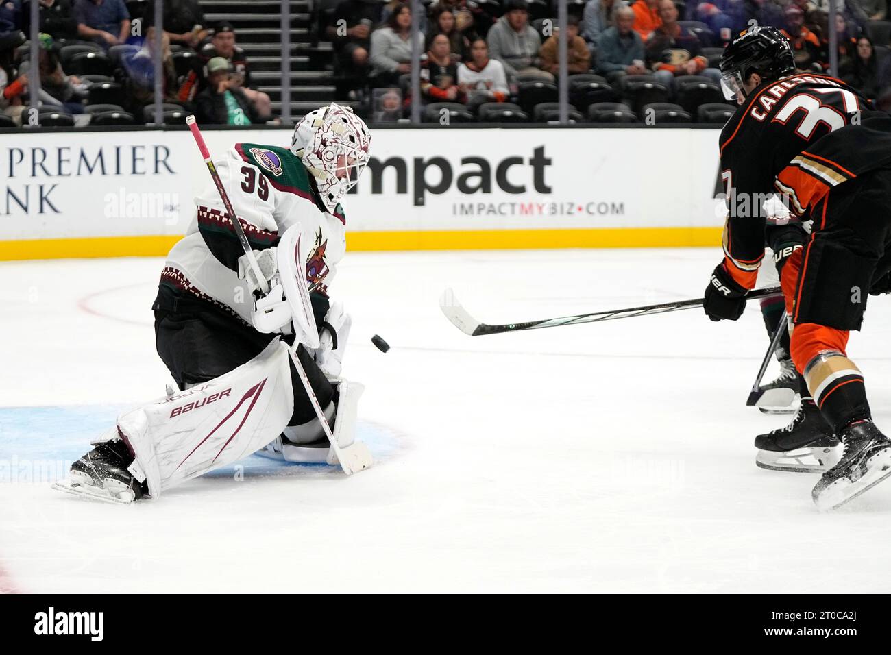 Anaheim Ducks center Leo Carlsson, right, tries to get a shot past ...