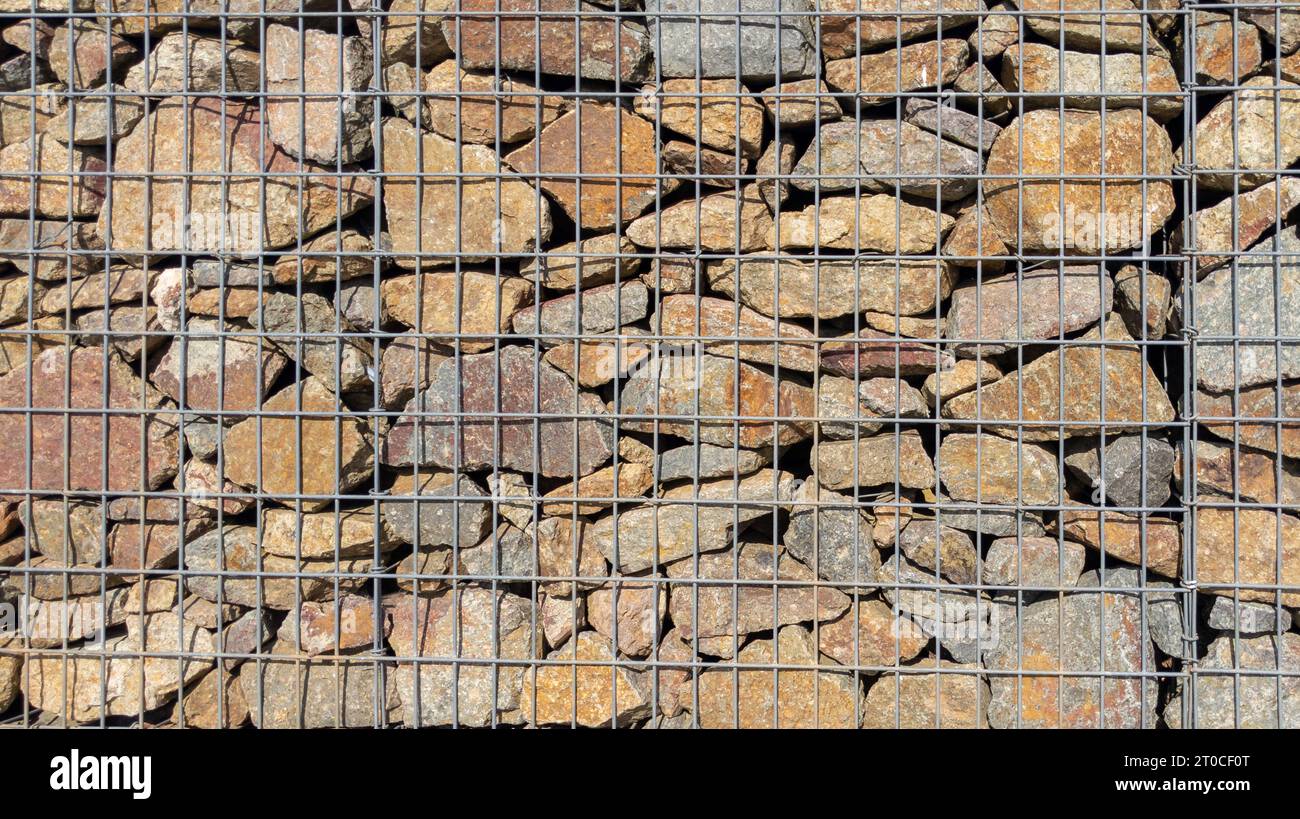 grated stone wall of rock horizontal stones outdoor facade background ...