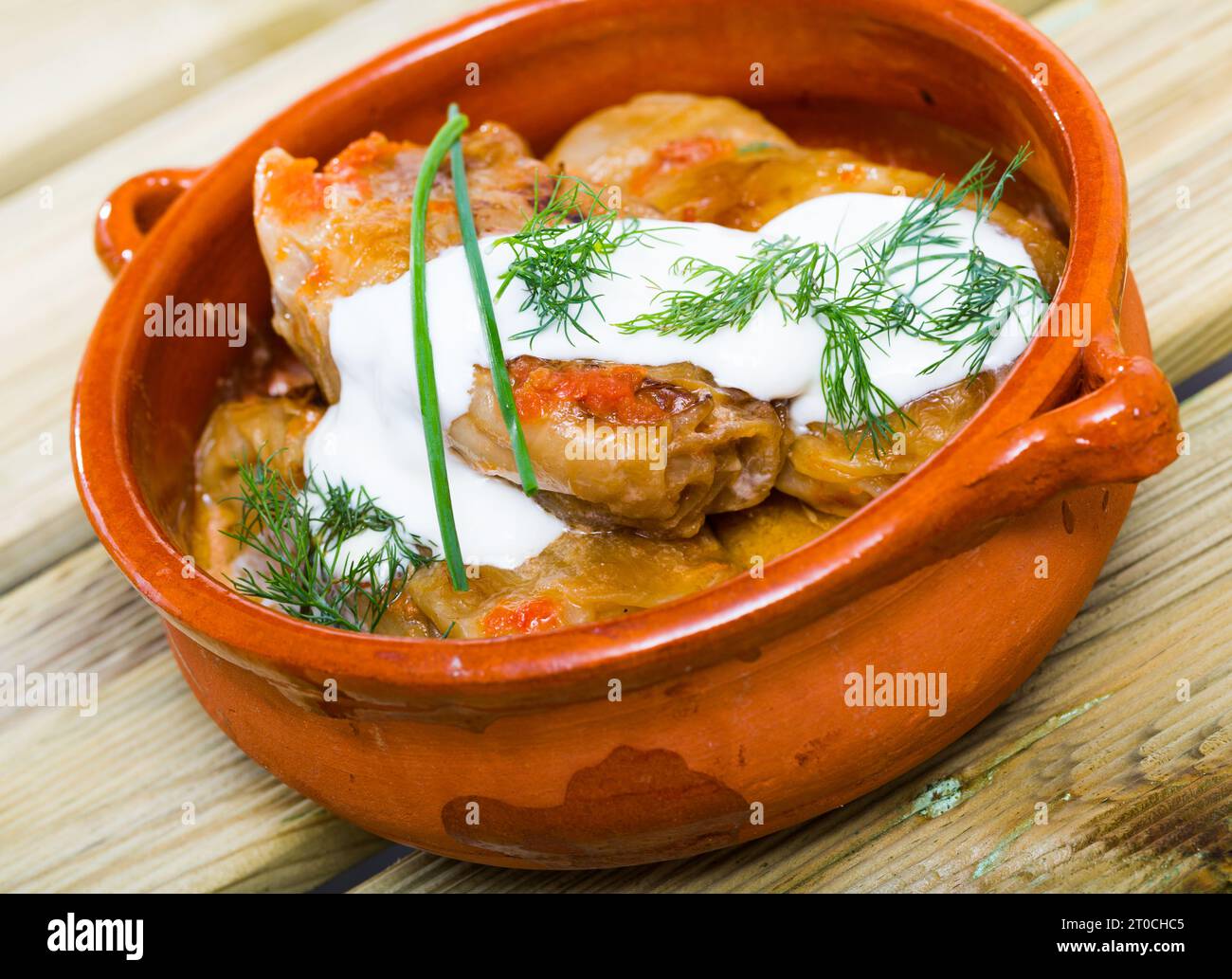 Photography of clay bowl with Sarmi which is cabbage leaves Stock Photo ...