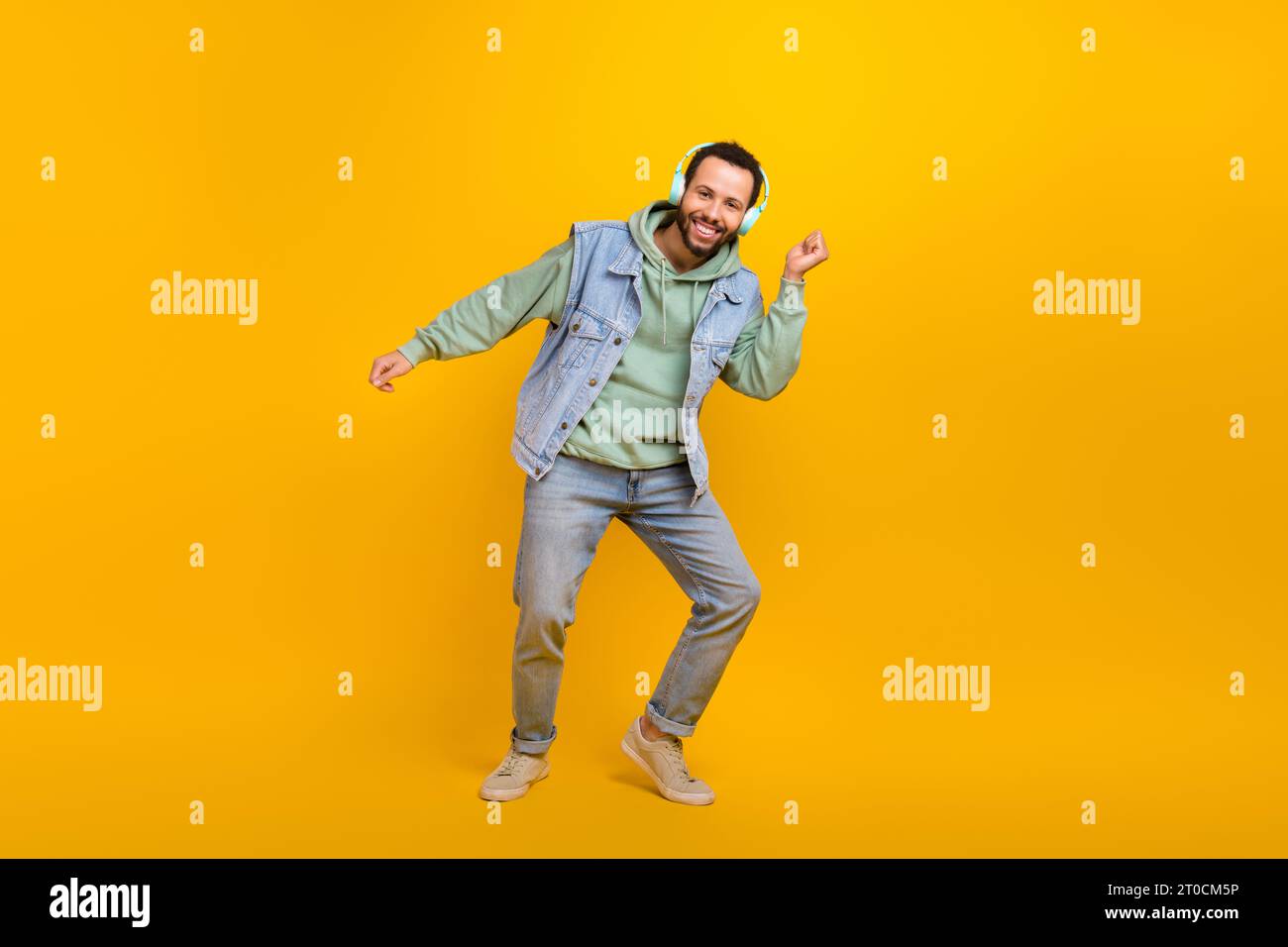 Full body length photo of dancing careless guy brunet hair listening ...