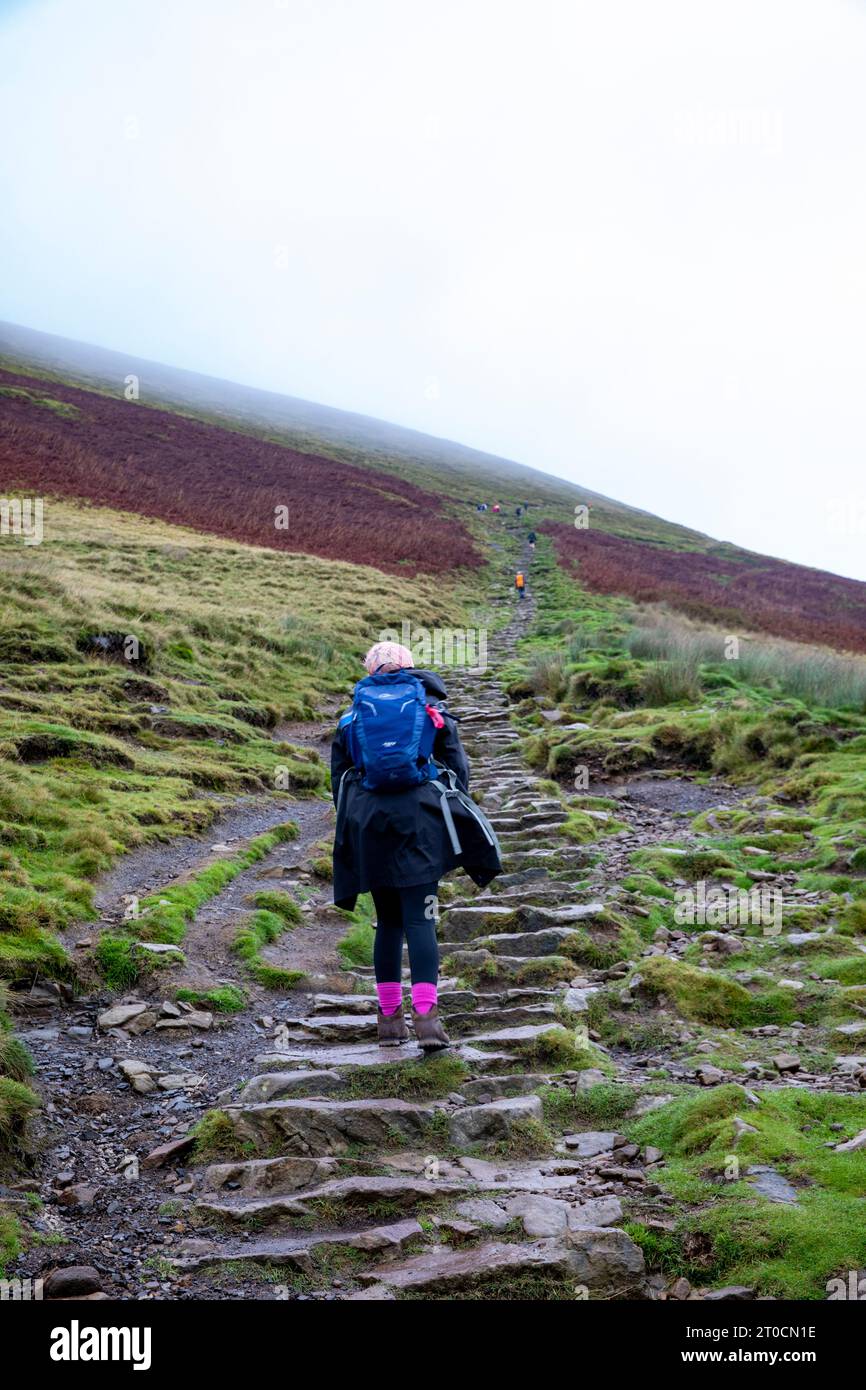 Pendle Hill Lancashire, female hiker with backpack and other walkers ...