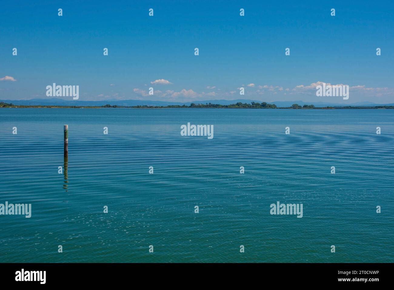 A channel marker shows the edge of a navigable channel in the shallow ...