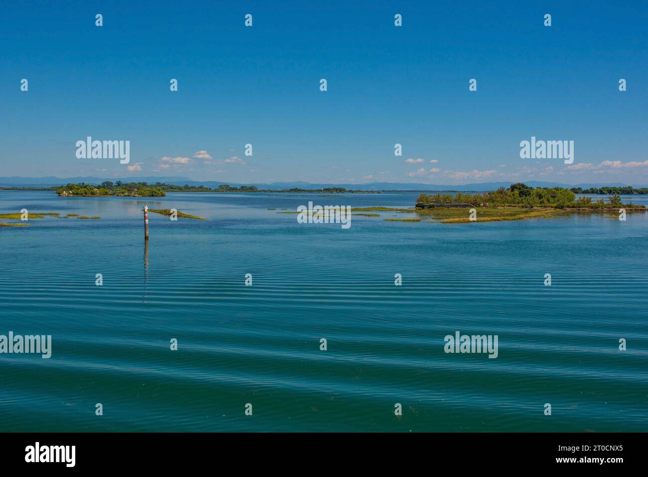 A channel marker shows the edge of a navigable channel in the shallow ...