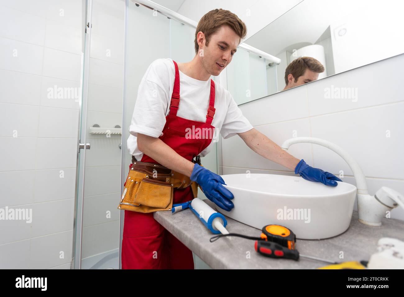 plumber service. wash basin installation Stock Photo - Alamy