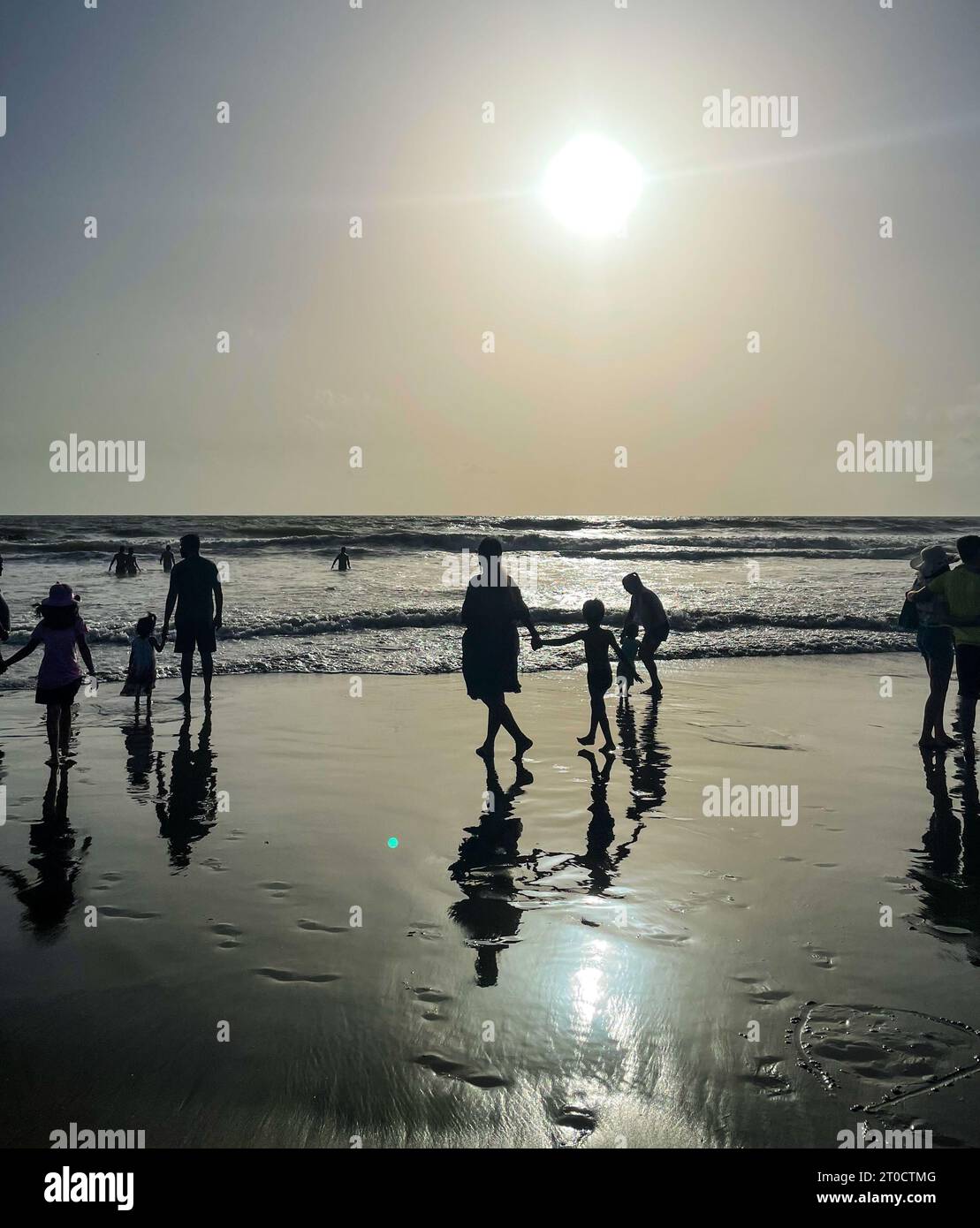 Chasing the Horizon: Witnessing the Beach Sun Stock Photo - Alamy