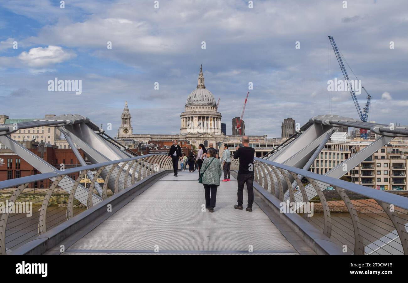 London, UK. 5th October 2023. People walk along Millennium Bridge towards St Paul's Cathedral ...