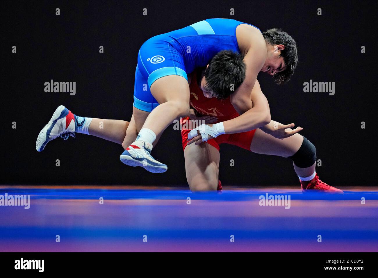 China's Long Jia and India's Sonam, top, compete during their women's ...