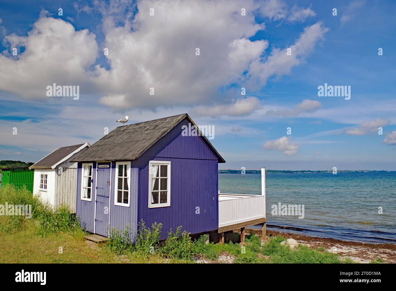 Colourful beach houses, bathing cottages on the beach of the Baltic Sea ...