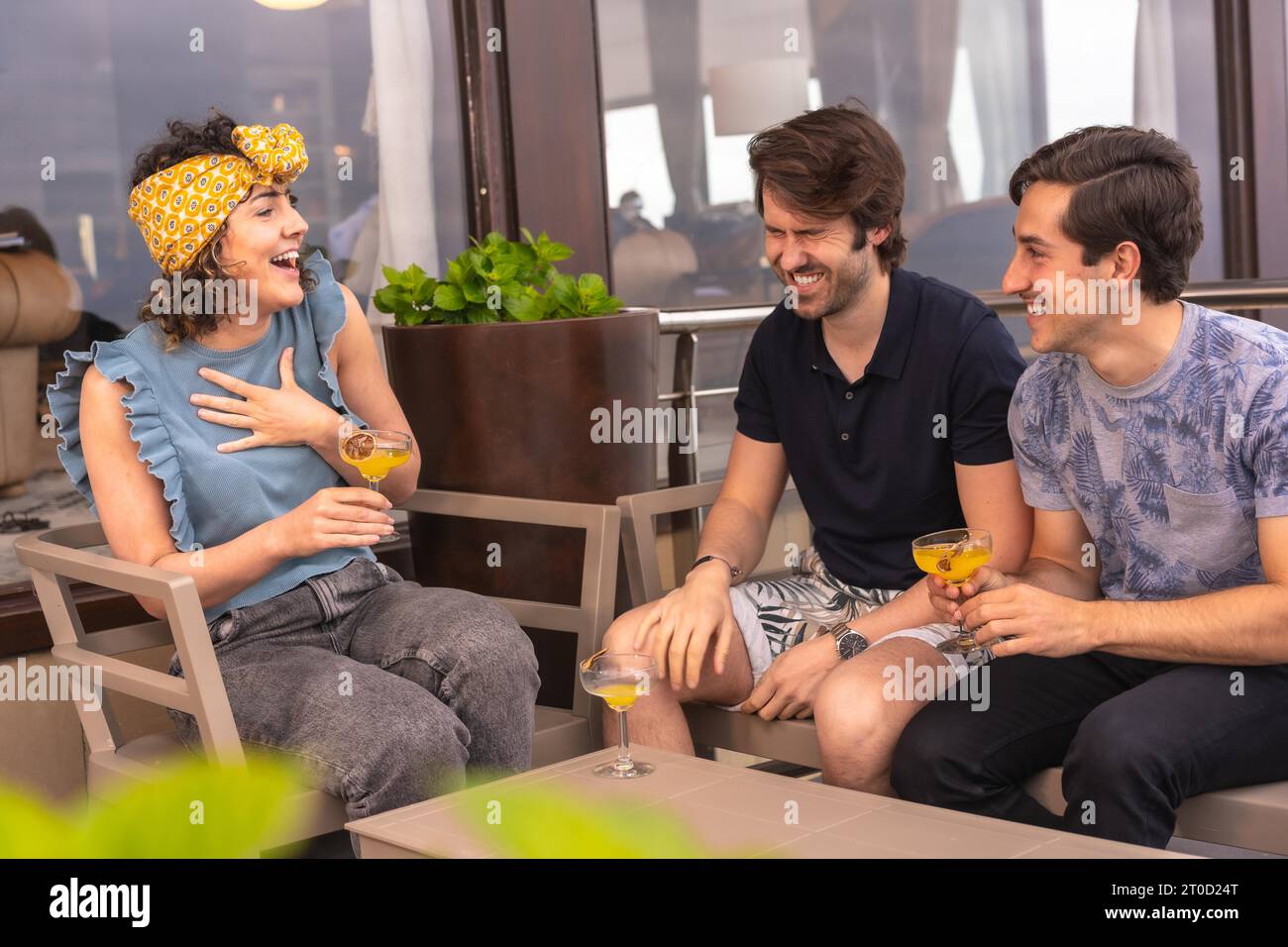 Friends having fun and laughing drinking cocktails in a terrace Stock ...