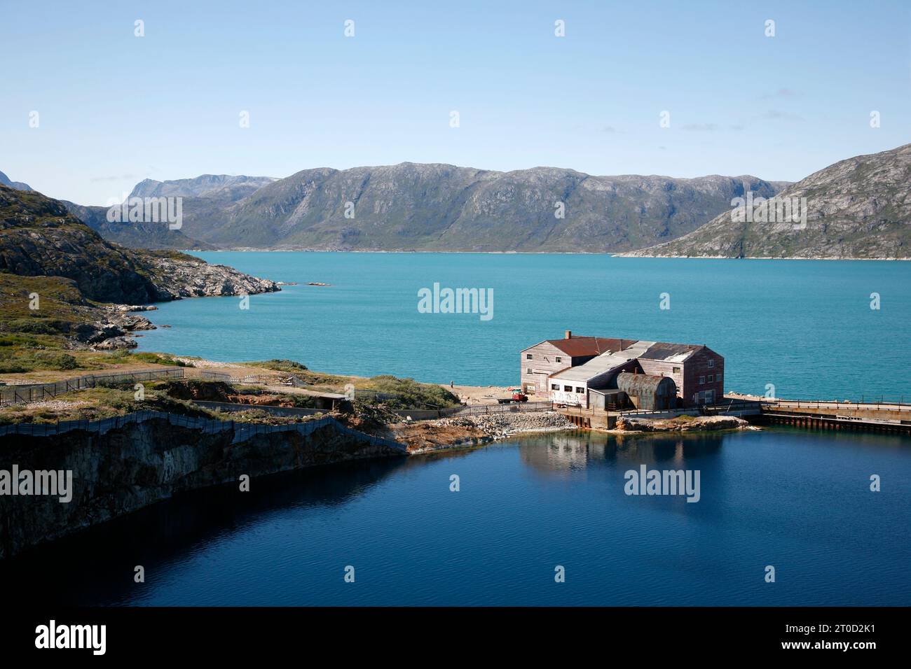The mine, today covered with water, in the miners town of Ivigtut ...