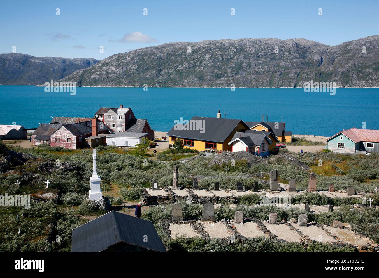 Cemetery and houses in the miners ghost town of Ivigtut, Greenland ...