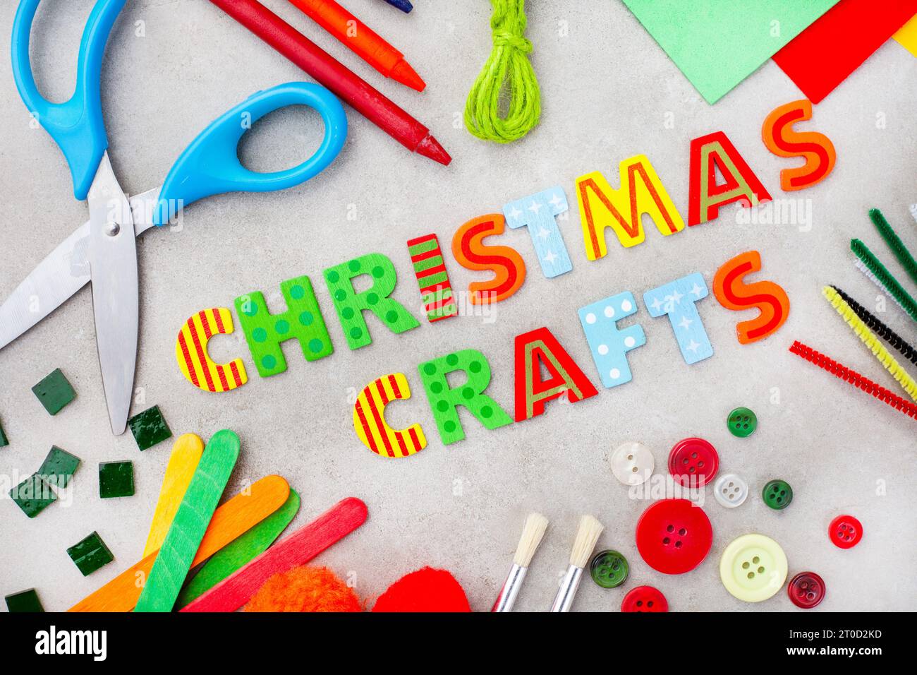 Christmas crafts in bright lettering with colorful craft supplies on a ...