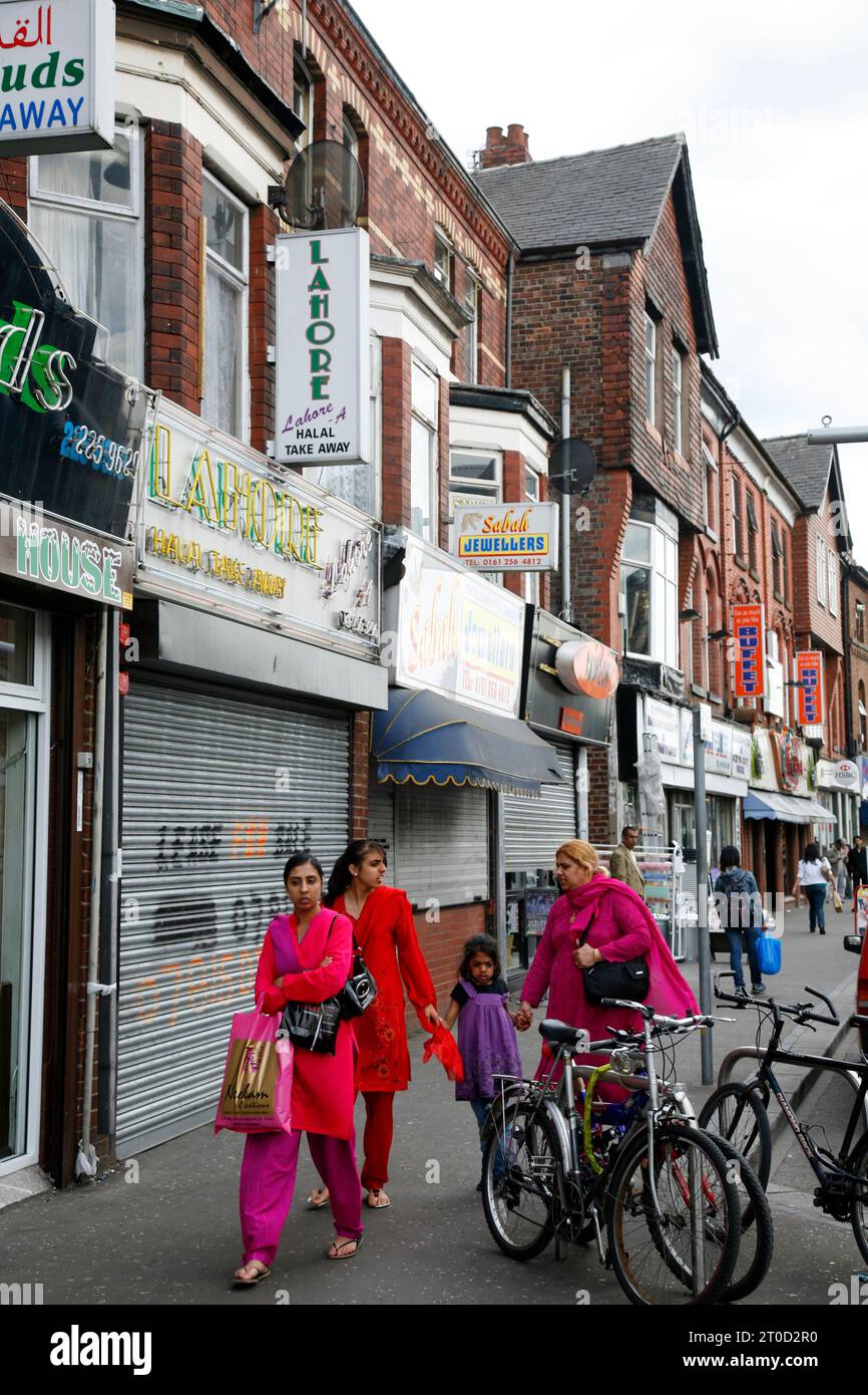 Street scene at the Rusholme area where many immigrants live ...