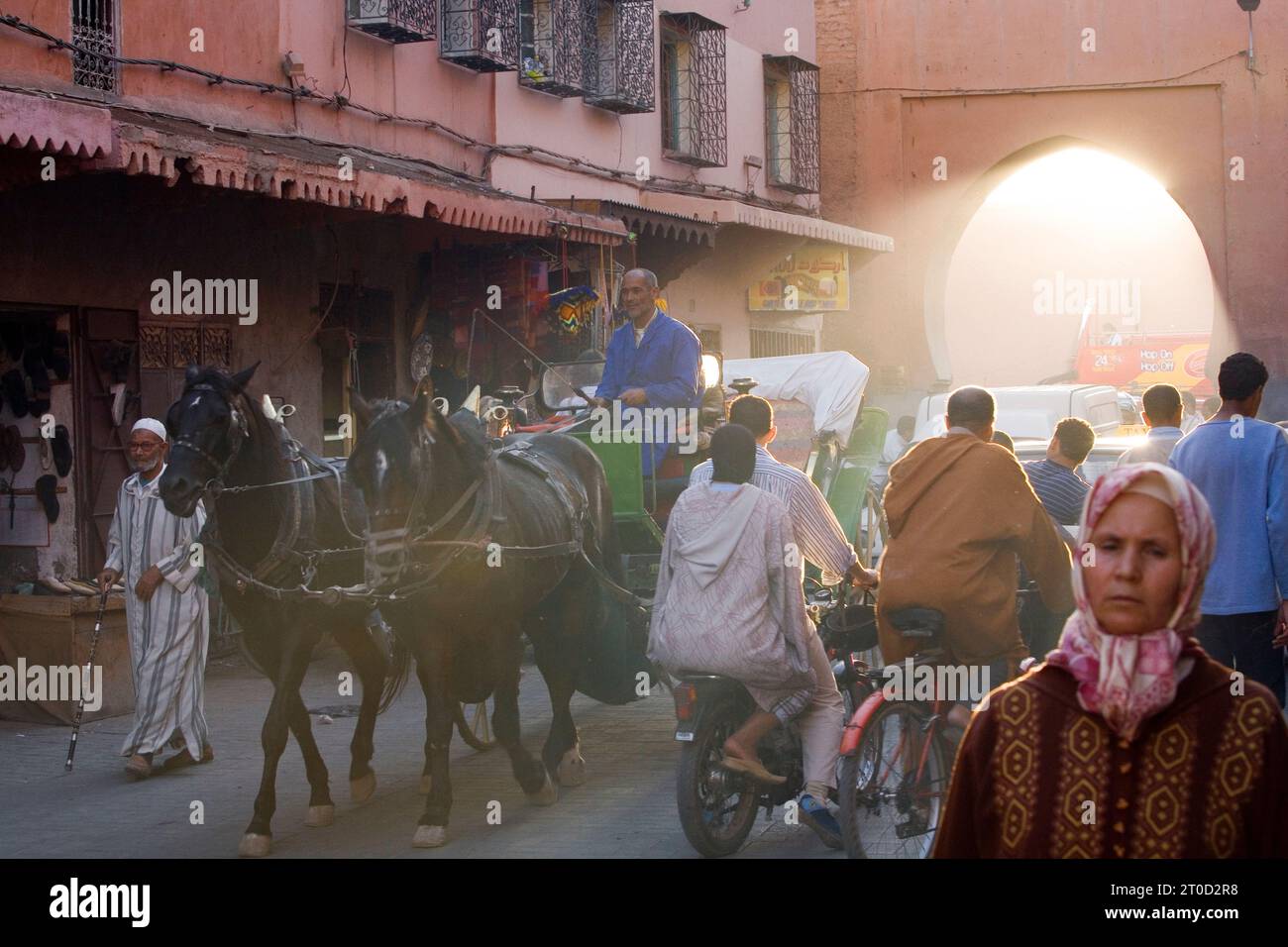 People and horse cart in a street at the Medina (old Town). Marrakesh ...