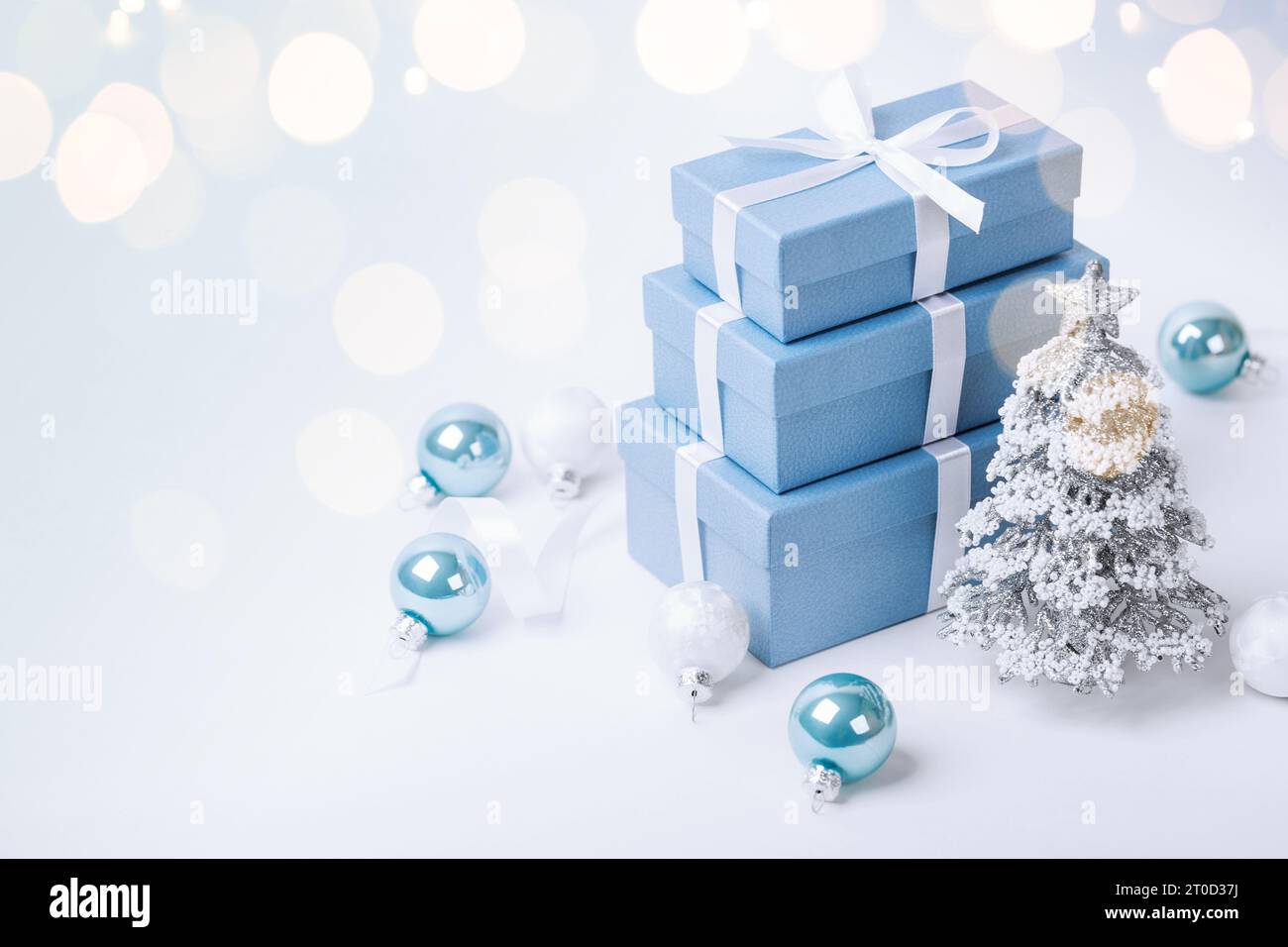 Christmas blue gifts with decorations on white background, copy space ...