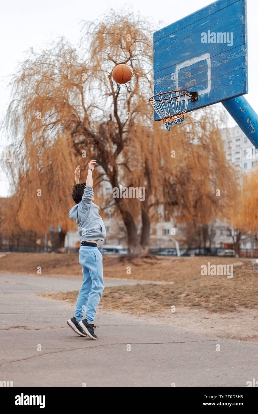 One young person playing basketball Stock Photo - Alamy