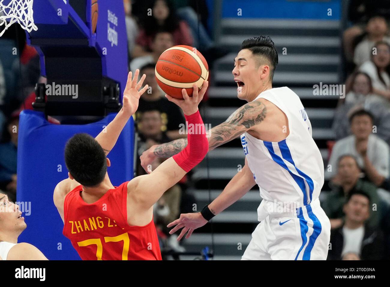 Taiwan's forward Liu Cheng (5) fouls China's forward Zhang Zhenlin during the men's bronze medal ...