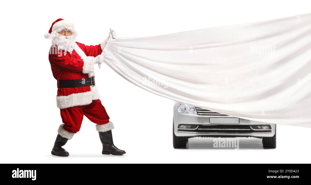 Santa Claus pulling a white piece of cloth in front of a silver car ...