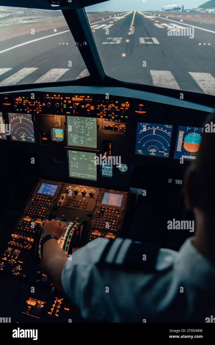 View from the cockpit of a commercial airplane simulator Stock Photo ...