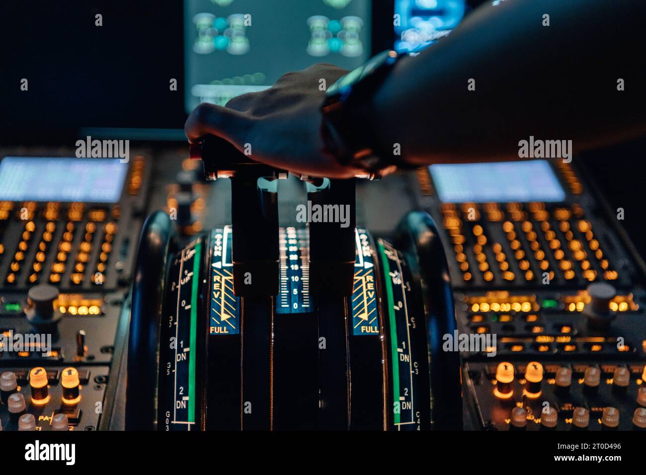 Hand of a pilot on the power levers of an airliner Stock Photo - Alamy