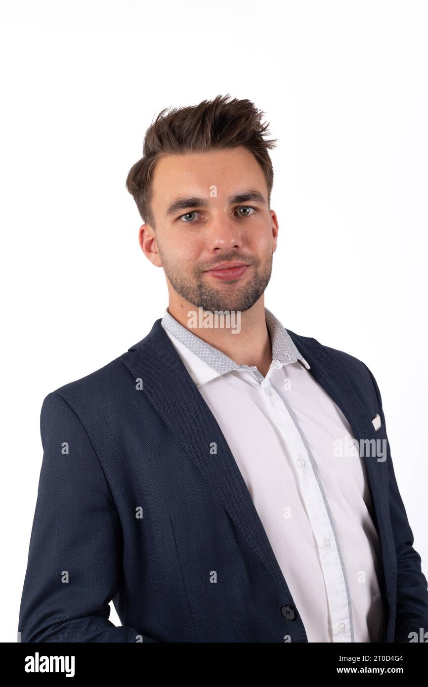 A handsome young man, dressed in a sharp suit, smiles, in a captivating ...