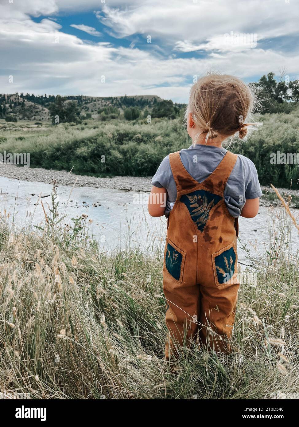 Girl overalls water hi-res stock photography and images - Alamy