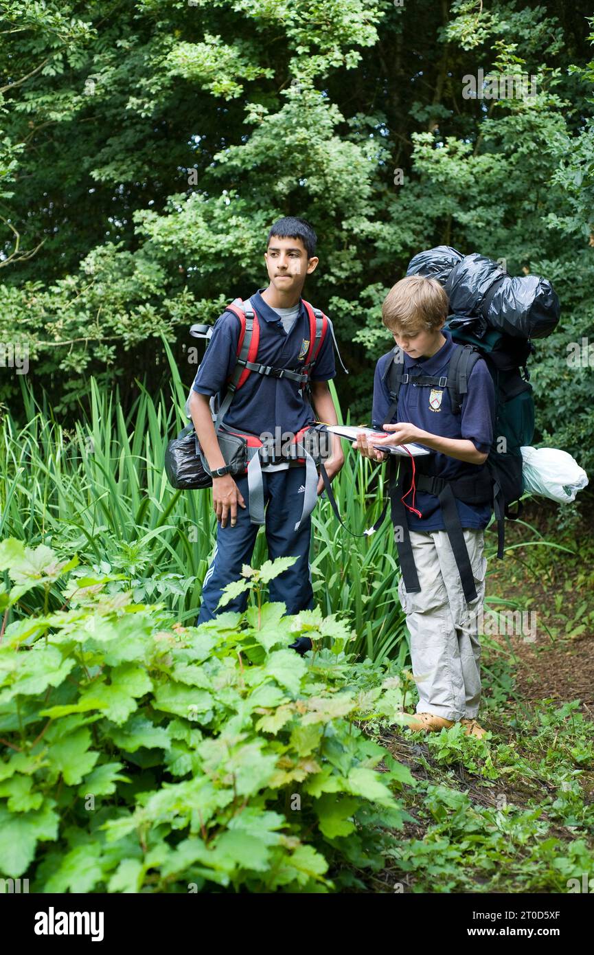 Secondary school pupils orienteering while on outward bound course ...