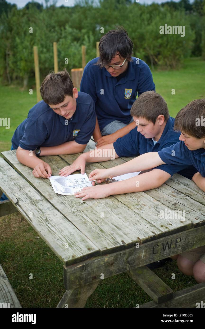 Secondary school male pupils orienteering while on outward bound course ...