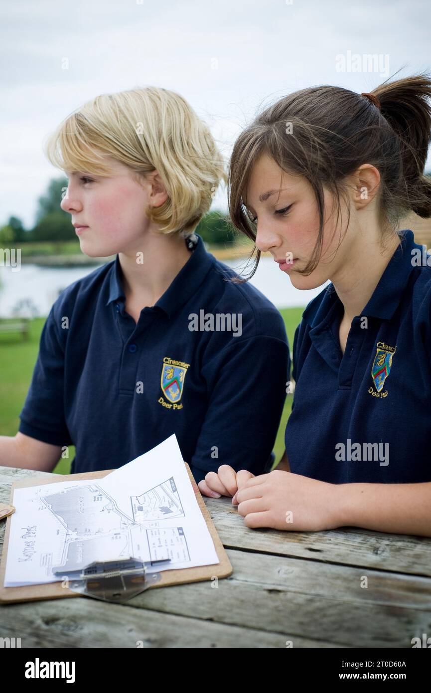 Secondary school teen girl pupils orienteering while on outward bound ...