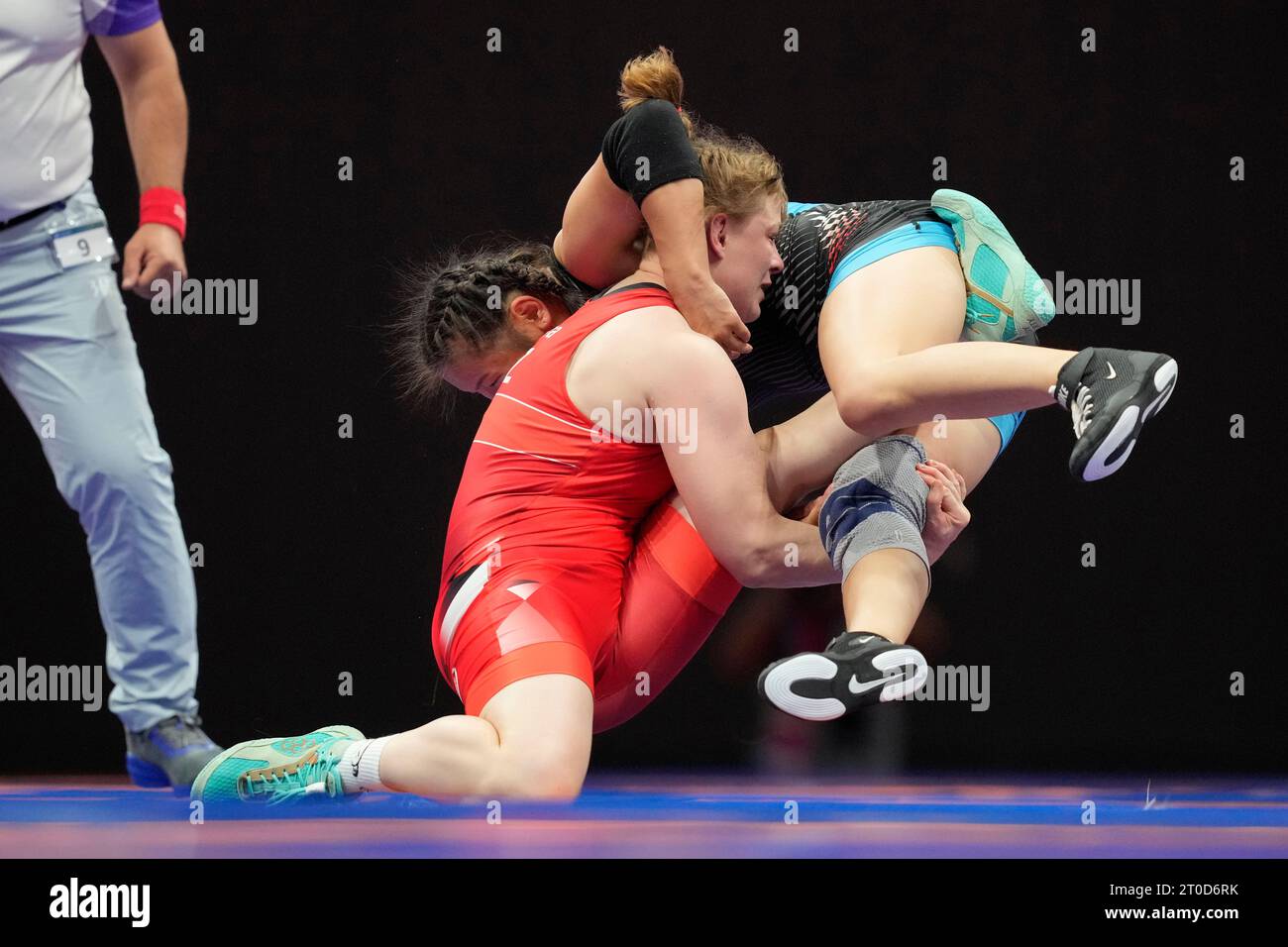 Kazakhstan's Yelena Shalygina and Mongolia's Delgermaa Enkhsaikhan, left, compete during their ...