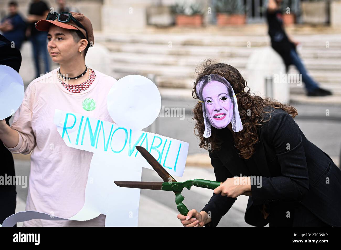 MILAN, ITALY - OCTOBER 6: a demonstrator wears a mask depicting Italian ...