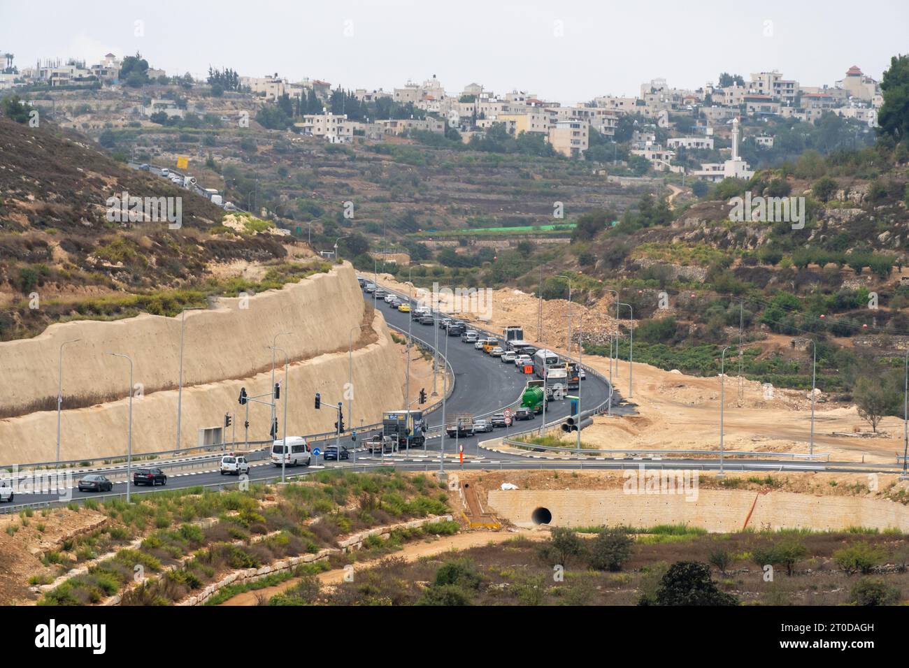 Cars drive in road number 35 which crosses the Green Line and ...