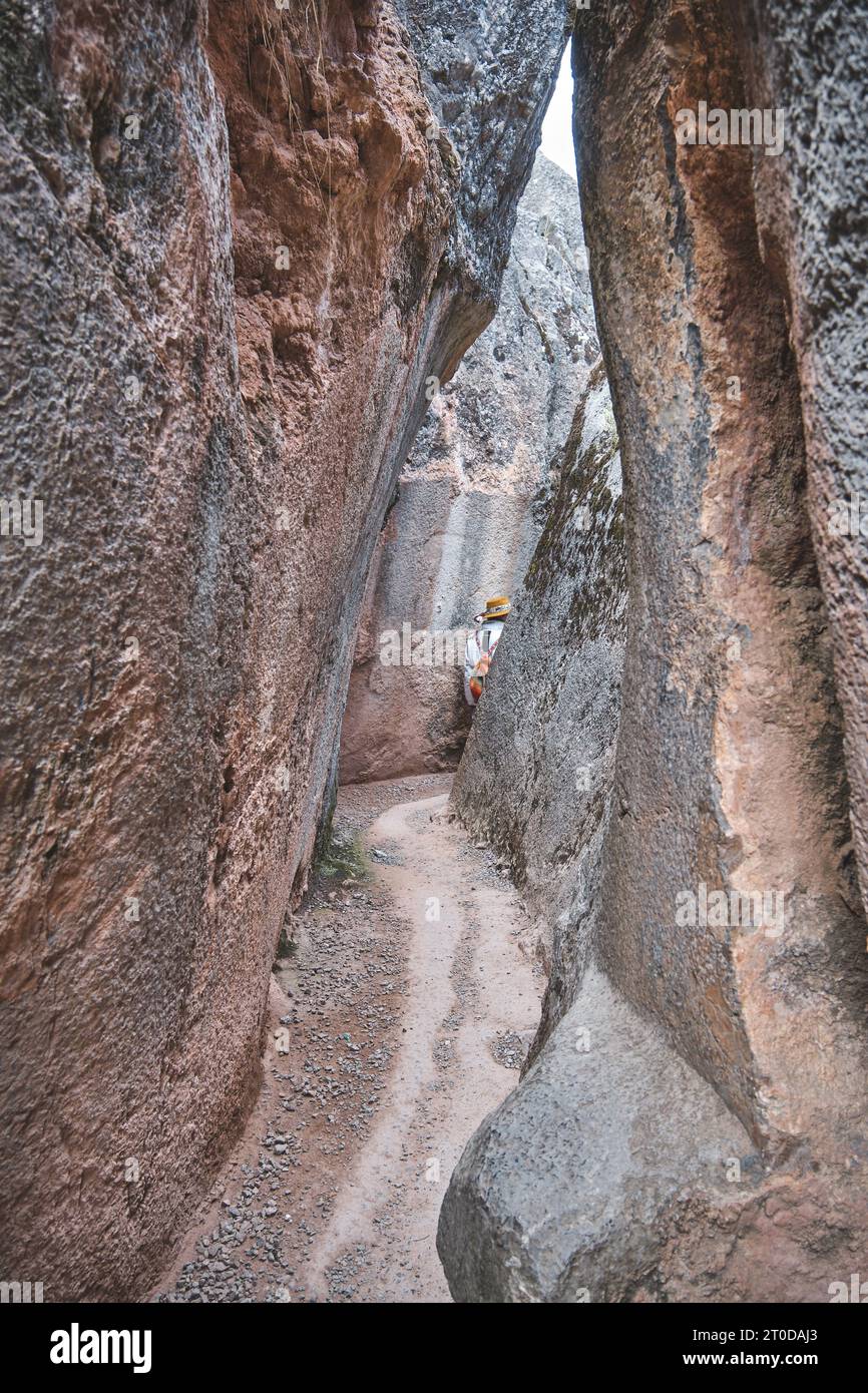 Tourist exploring at Archaelogical Qenqo. Strange and weird rock ...