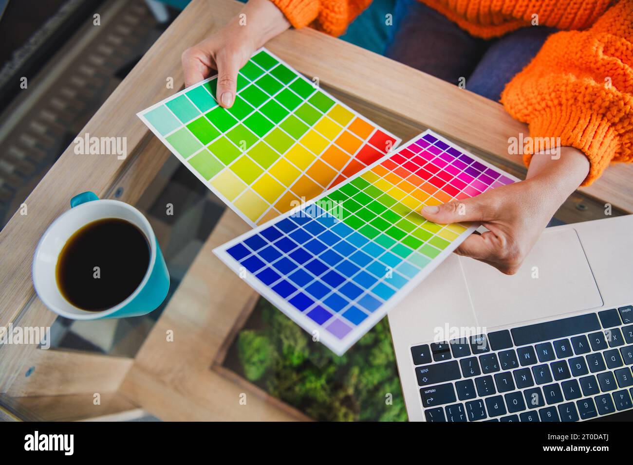 Photo of elderly lady hands arms wear orange pullover holding colors ...