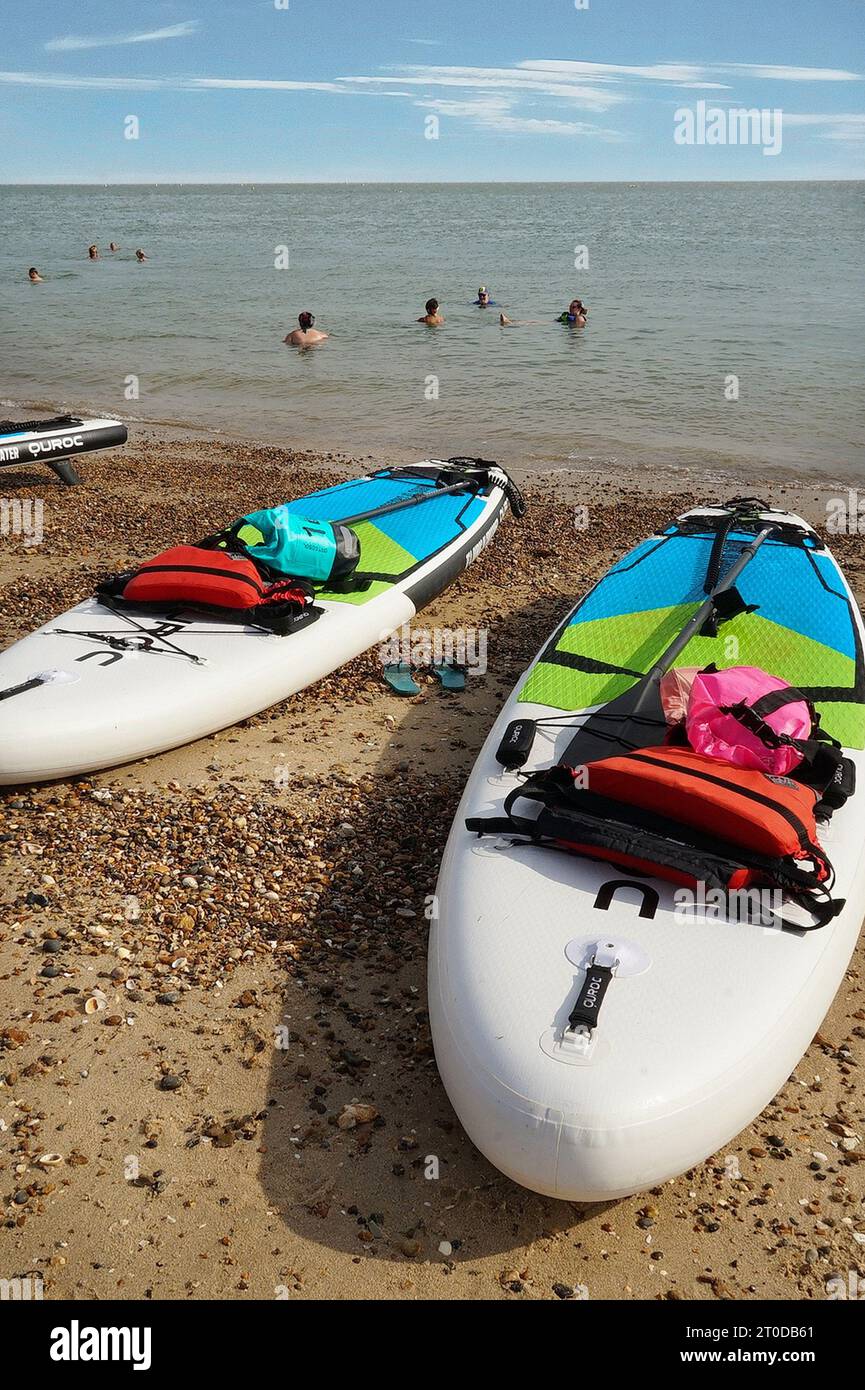 Paddleboard on beach Stock Photo - Alamy