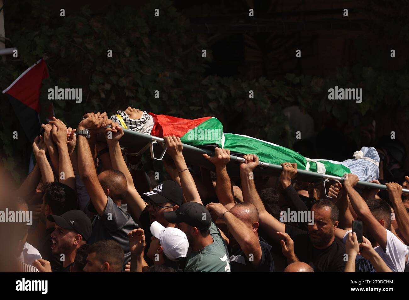 Huwara, Palestinian Territories. 06th Oct, 2023. Palestinians carry the ...