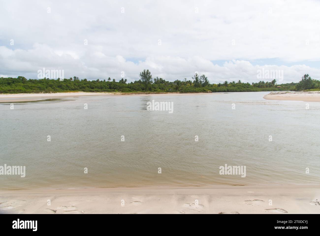 Waters from a river that flows into the sea. white sand on the beach ...