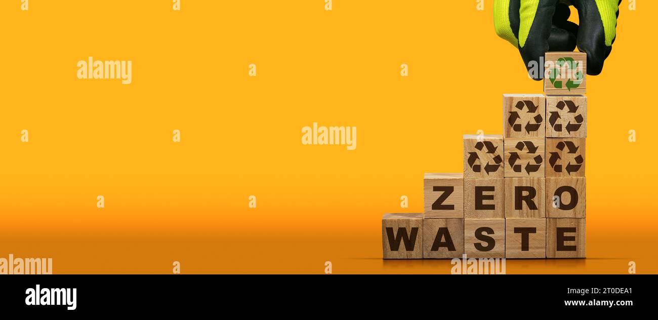 Gloved hand arranging wood blocks with text Zero Waste and Recycling ...