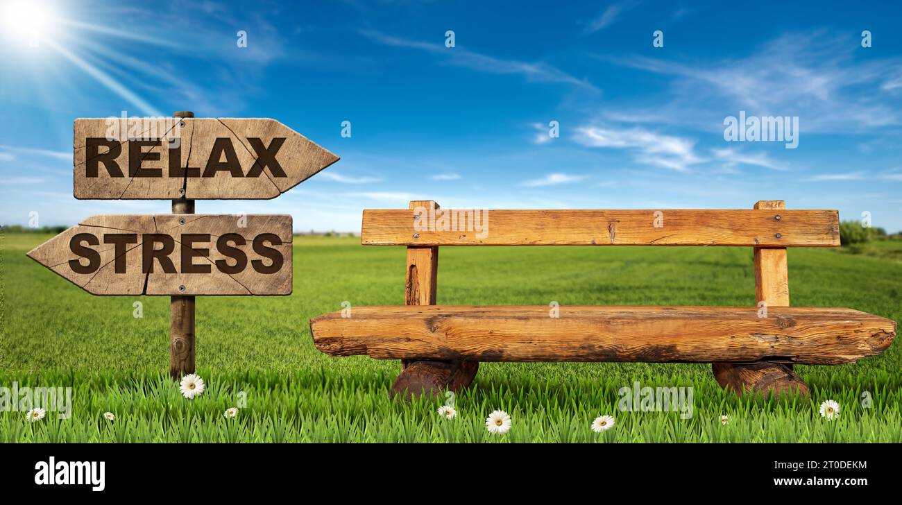 Wooden directional signs with text Relax and Stress on a countryside ...